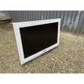 A small Panasonic flat screen tv with manual and remote