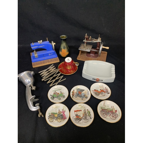 Two children's sewing machines, wool winder, cream maker and china