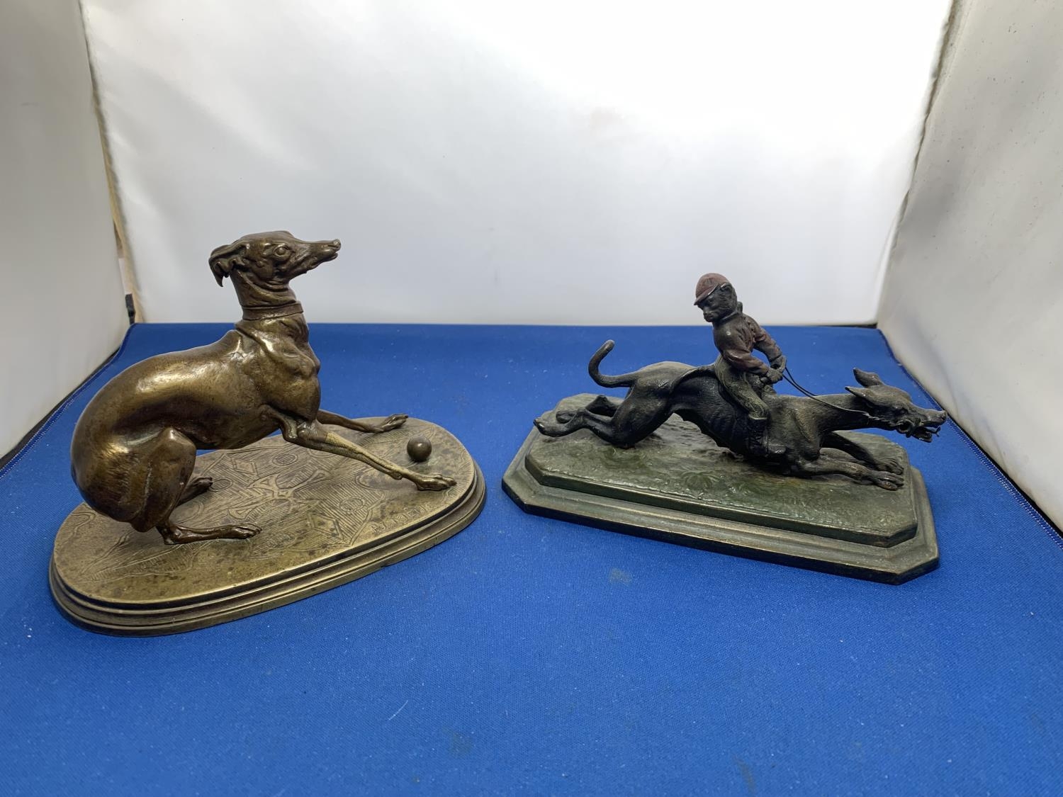 Bronze figure of dog with ball Signed P J Mene, height 11 cms length of ...