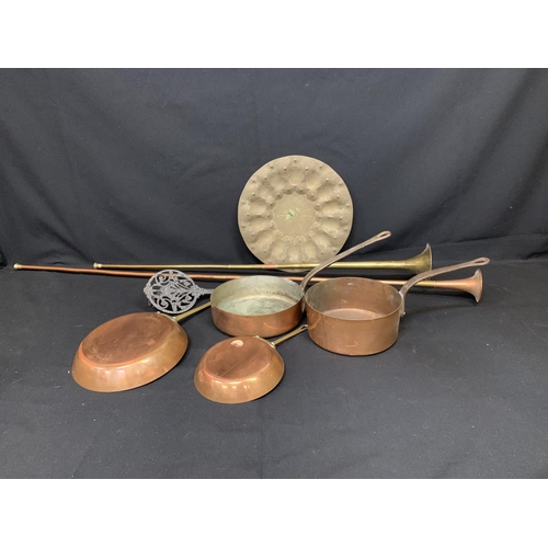 Two coaching horns, four copper pans and metalware