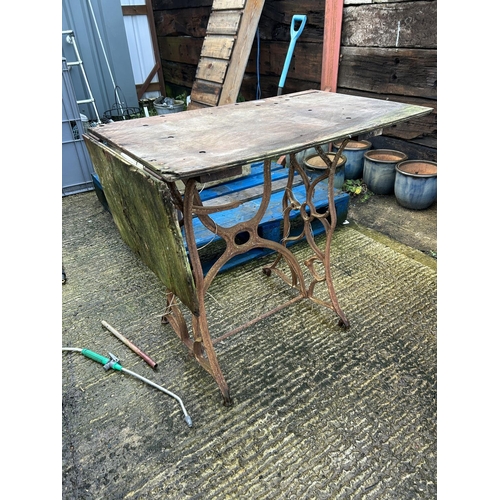 A vintage iron sewing machine table base