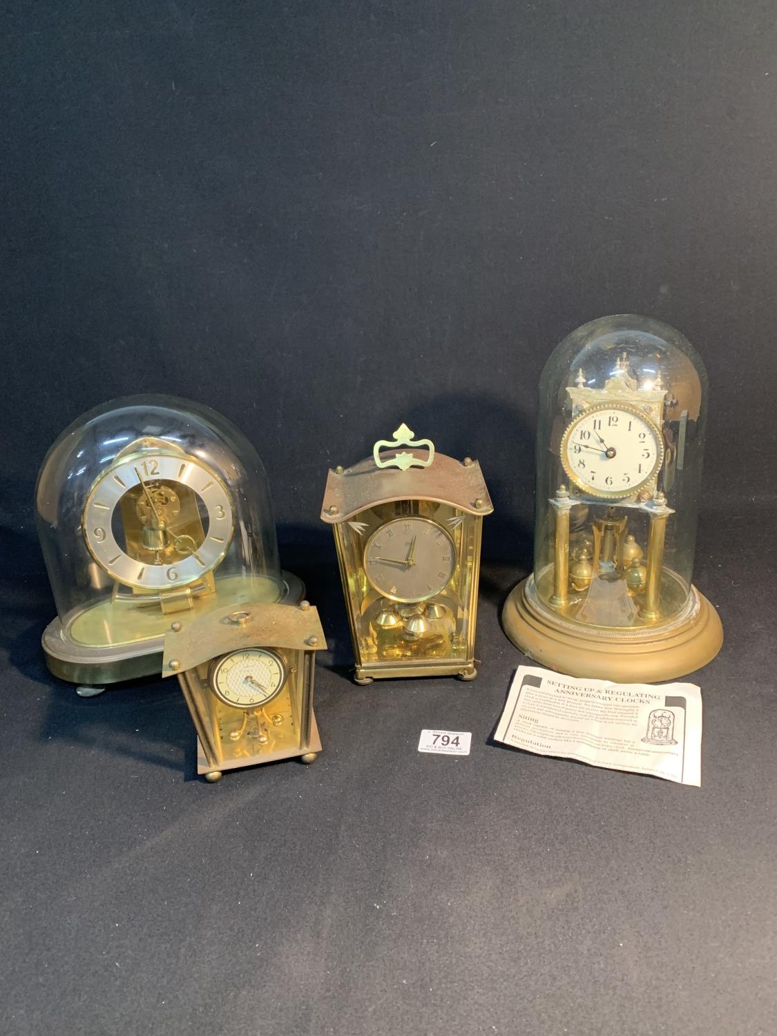 Domed Anniversary Clock with Key and 3 other clocks