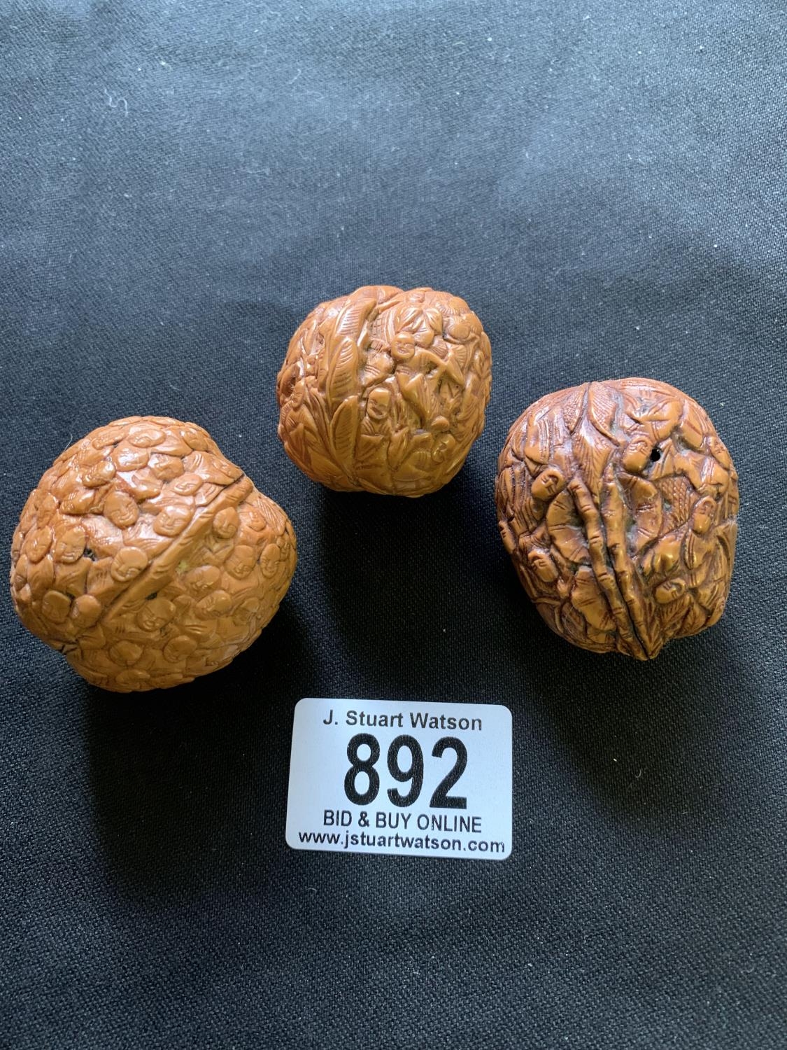 Three carved Walnuts
