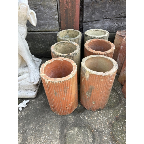 Six large terracotta pipe sections