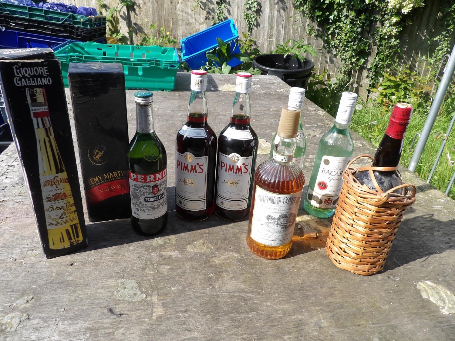Nine bottles of drink including one boxed Brandy