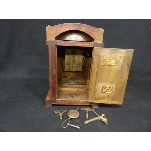 Arts and Crafts mantle clock, with keys and pendulum, height 36cms