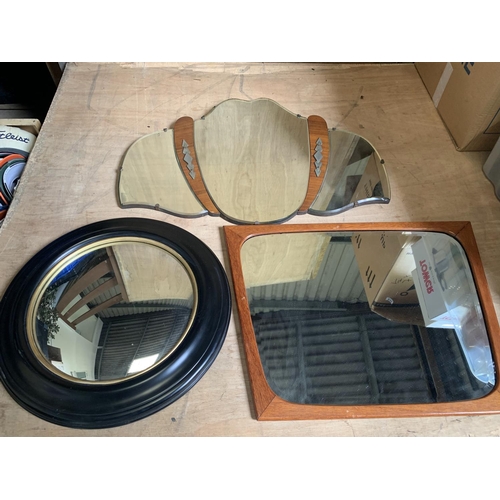 Concave circular wall mirror and two others