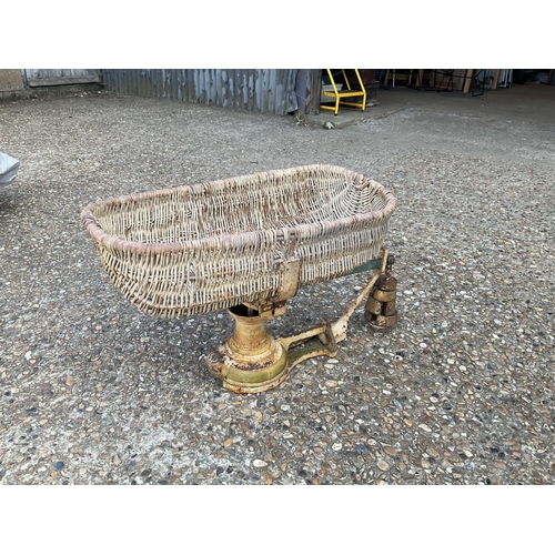 A set of vintage baby weighing scales