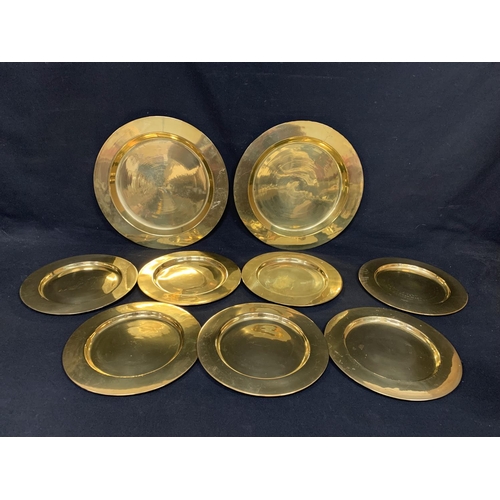 2 heavy brass platters, diameter 38cms and 7 brass plates