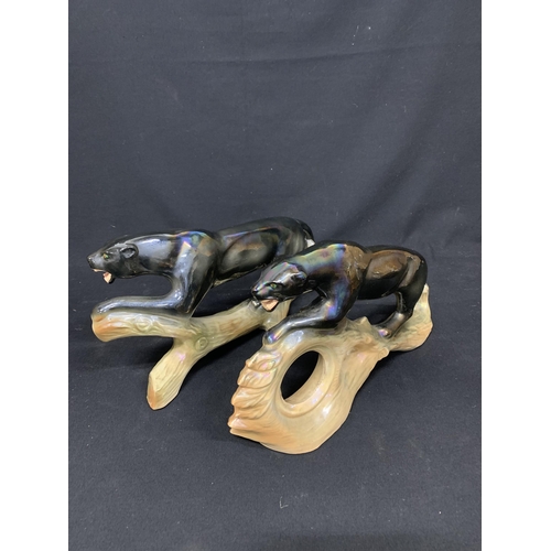 2 Panther figures, longest 50cms, repair to back leg