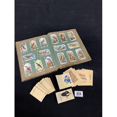 Cigarette card album and silk cards