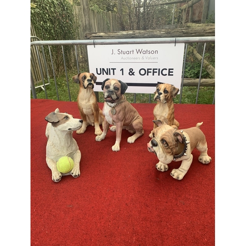 Five large resin dog figures