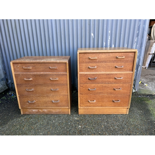 A large and small pair of light oak g plan chests of drawers
