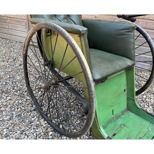 An unusual Victorian bath chair with buttoned leather seat