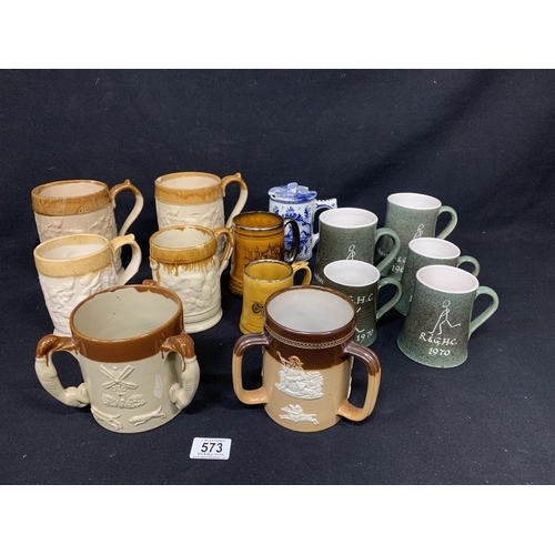 Two loving cups and a collection of pottery tankards
