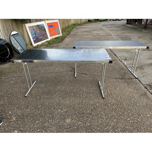 A pair of alu lite folding tables 180x770x90