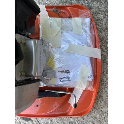 A FLYMO XL500 petrol hover mower, hardly used with instruction manual