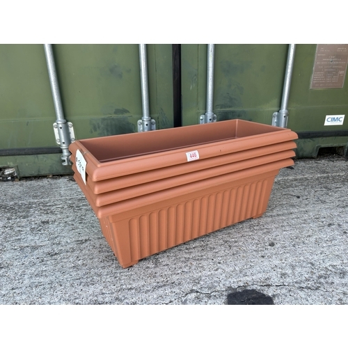 Four new plastic trough planters