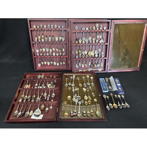 Collection of 82 souvenir teaspoons in 3 display racks and 32 loose ...
