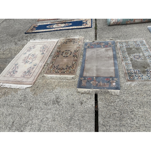 Four assorted small Chinese rugs