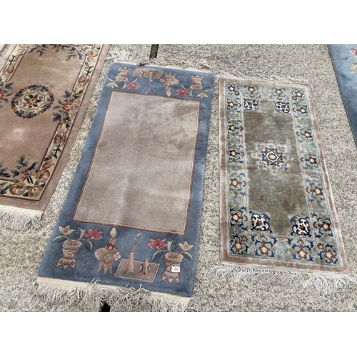 Four assorted small Chinese rugs