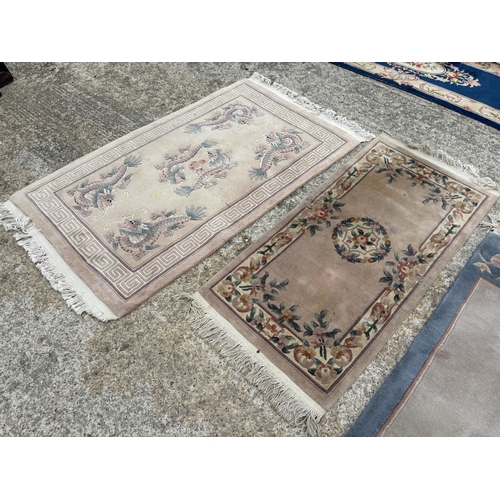 Four assorted small Chinese rugs