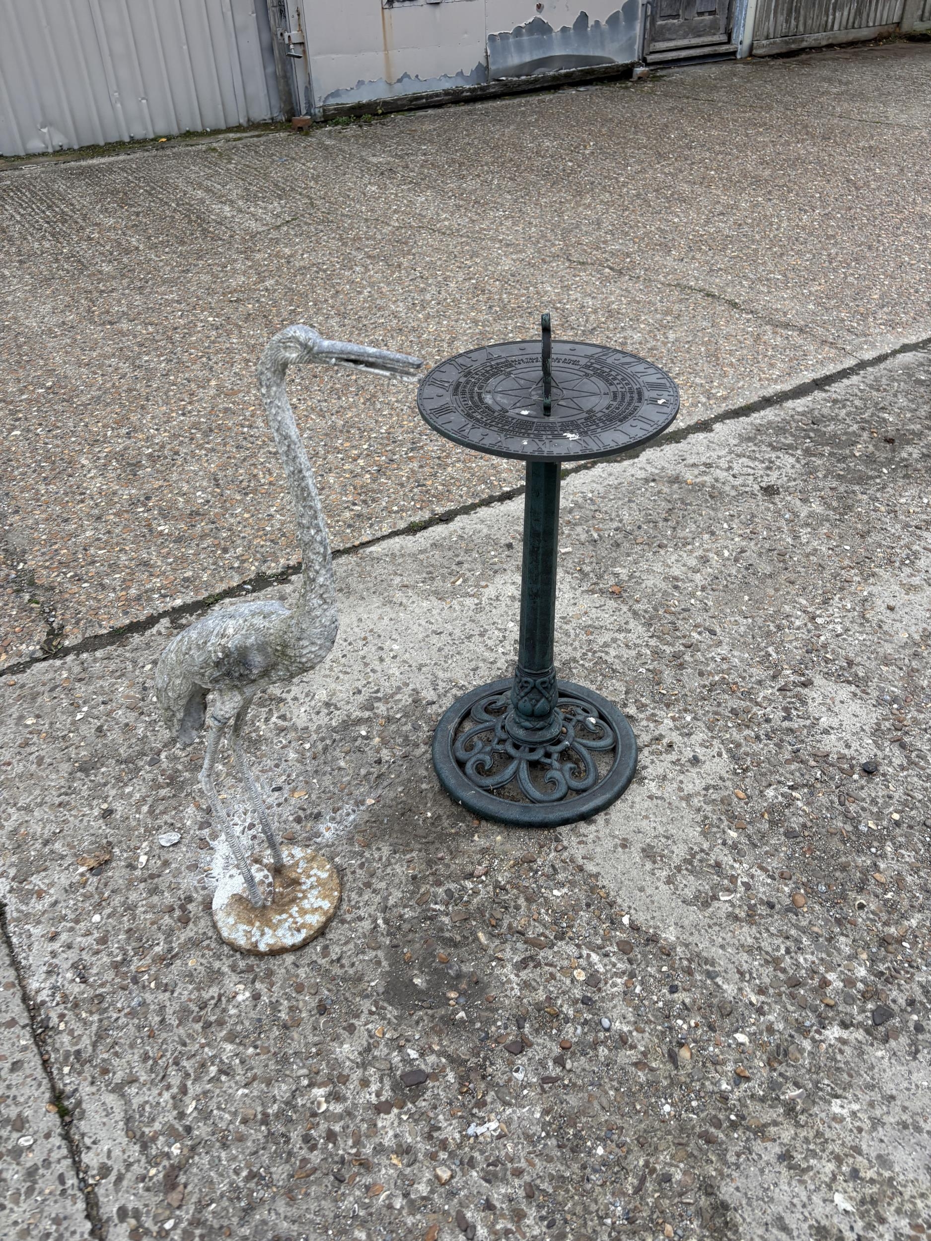 Herron statue and sun dial