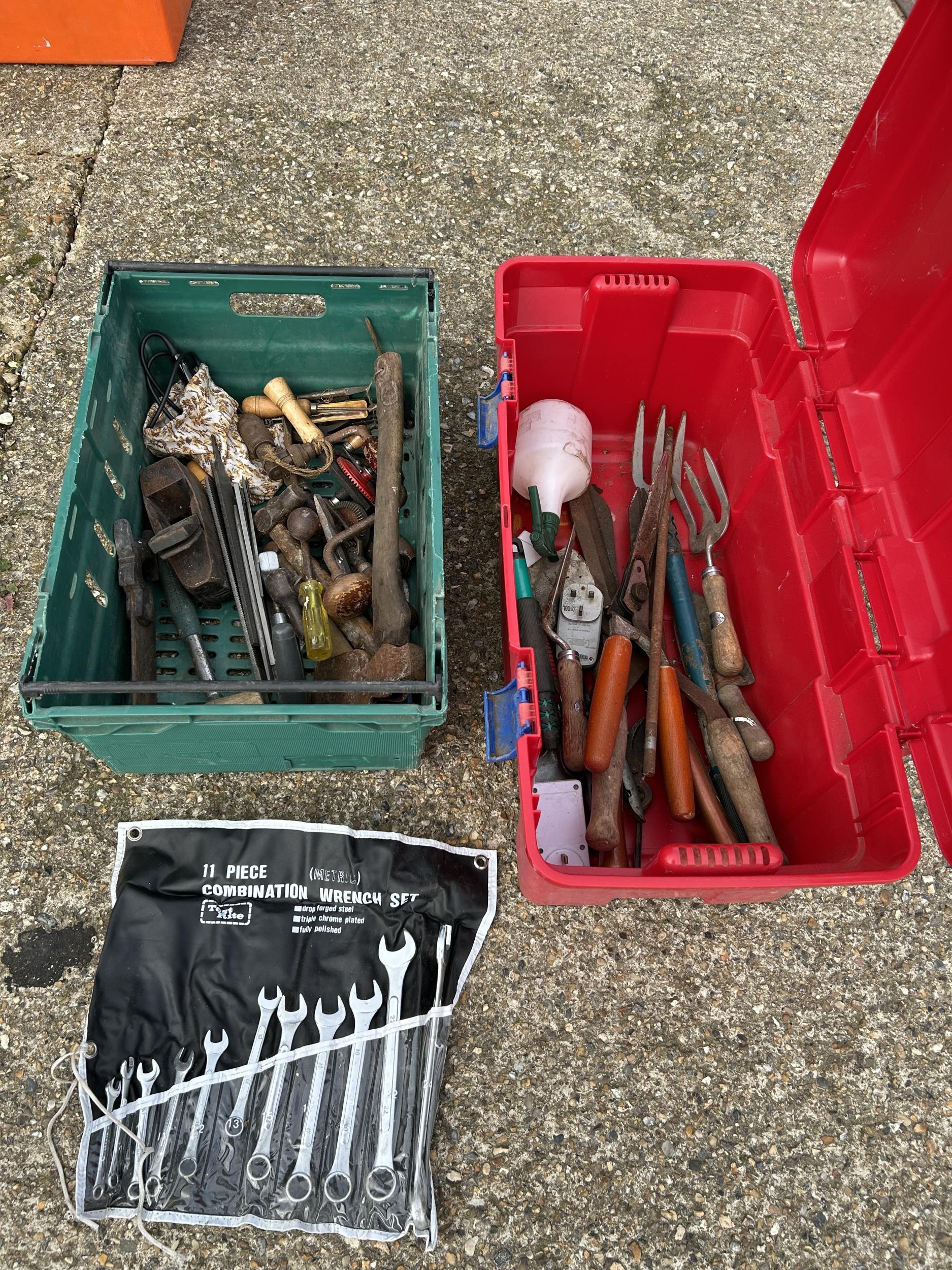 Tools, spanners and red box of hand garden tools