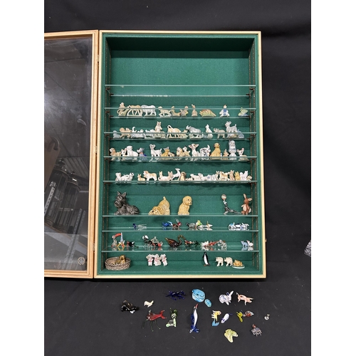 Collectors Glazed Display Cabinet containing Wade Whimsies and coloured ...