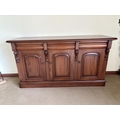 A reproduction mahogany sideboard with three drawers offer three doors ...