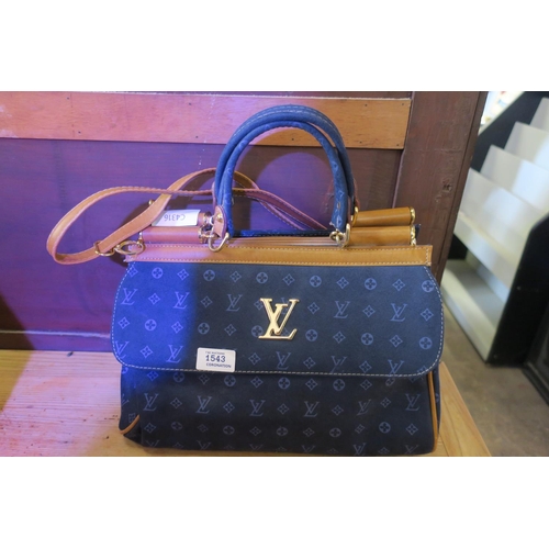 A BEUTIFUL DARK BLUE BAG WITH BROWN DESIGN