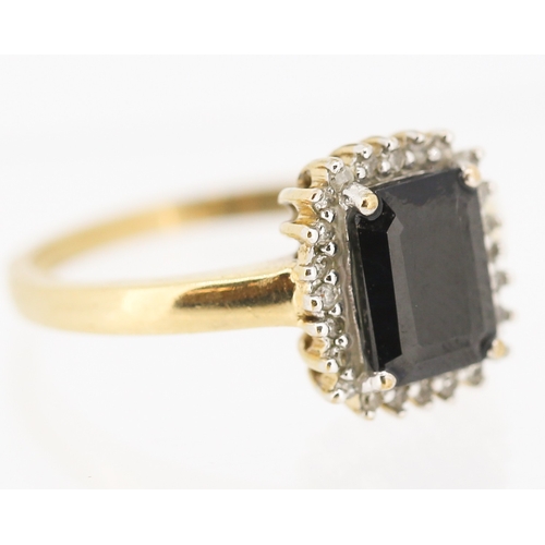 Emerald Cut Sapphire Set Ring with Diamond Inset Surround Mounted in 9 ...