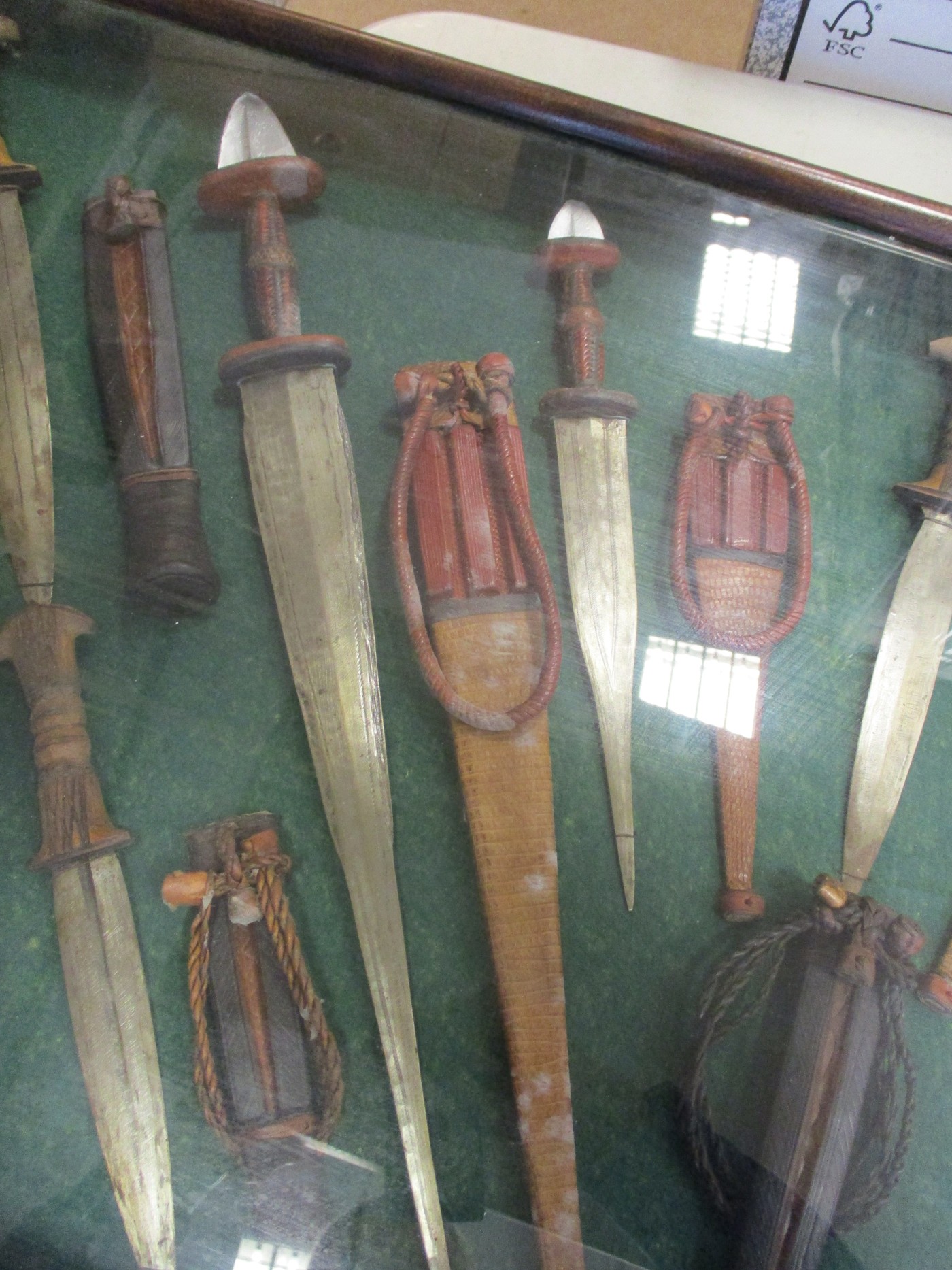 Collection of 11 West African straight bladed knives and daggers with ...
