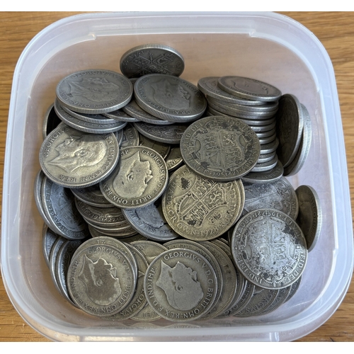 Collection of half crowns and florins in plastic tub, generally very ...