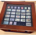 Large wood and glass display case with USA stamps