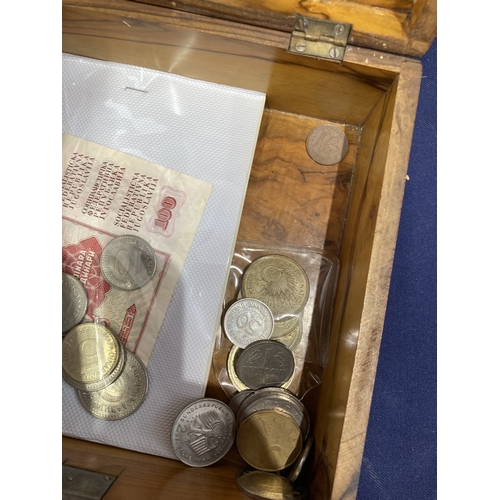 Wooden box with old World Currency and bank notes