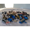 A collection of corgi farm animals and toys