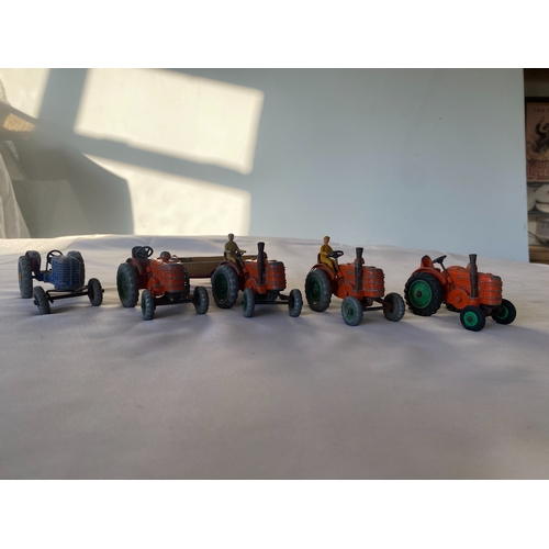 A collection of Dinky toy field marshal tractors