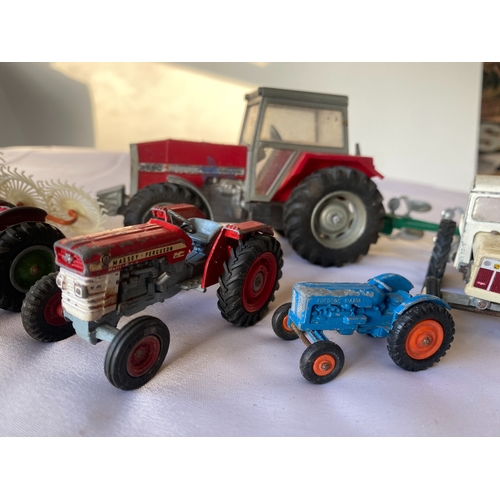 A collection of vintage model tractors