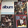 A collection of four vinyl long-playing (LP) records with their ...