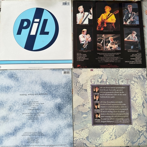 A collection of four 12-inch vinyl long-playing records (LPs) with ...