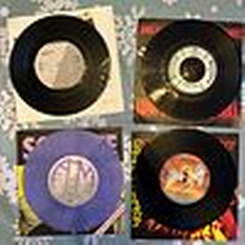 A collection of eight 7-inch vinyl singles, primarily from the late ...