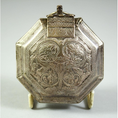 AN ISLAMIC WHITE METAL OCTAGONAL QURAN AMULET BOX, possibly silver, 7 ...