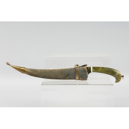 AN INDIAN JADE HANDLED DAGGER, with curving blade and wooden sheath ...