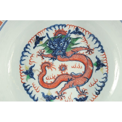 A PAIR OF LARGE CHINESE TRICOLOUR PORCELAIN PLATES, six-character mark ...
