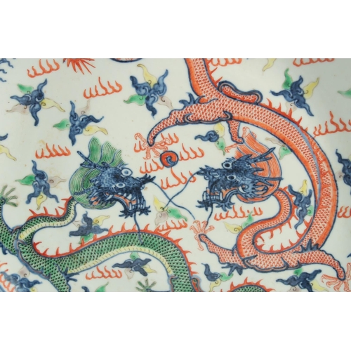 A PAIR OF LARGE CHINESE TRICOLOUR PORCELAIN PLATES, six-character mark ...