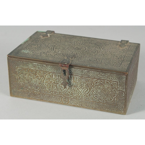 A 19TH CENTURY SYRIAN DAMASCUS ENGRAVED BRASS QURAN BOX, with panels of ...