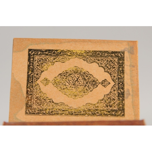AN OTTOMAN MINIATURE QURAN, with gilt lettering.