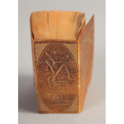 AN OTTOMAN MINIATURE QURAN, with gilt lettering.