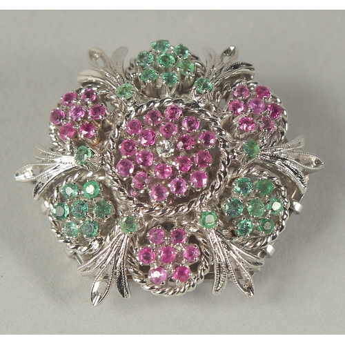 A GOOD 18CT WHITE GOLD DIAMOND RUBY AND EMERALD CIRCULAR BROOCH.